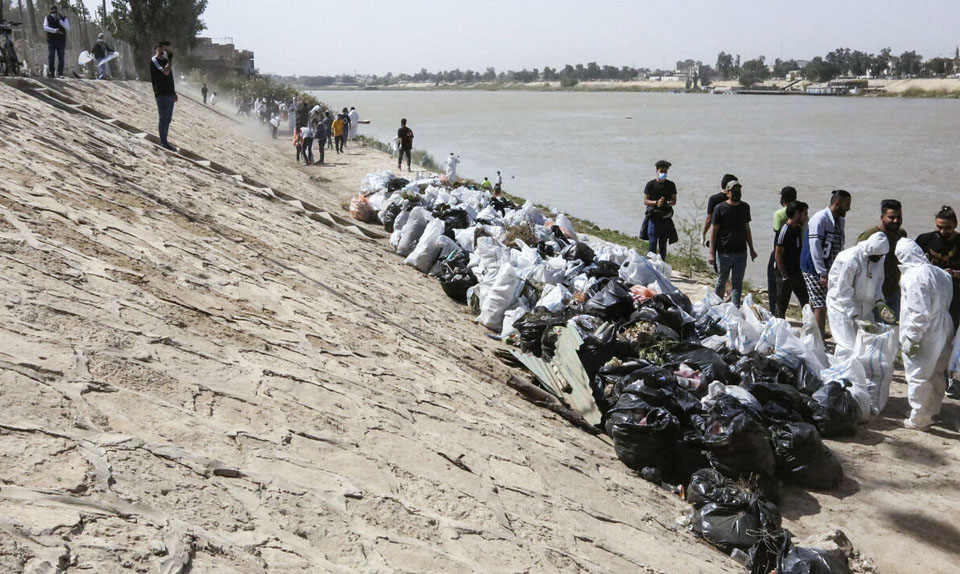 Iraqis clean up river as first green projects take root | News