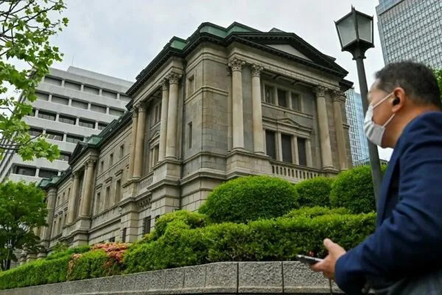 Bank of Japan maintains monetary easing but plans review | Business