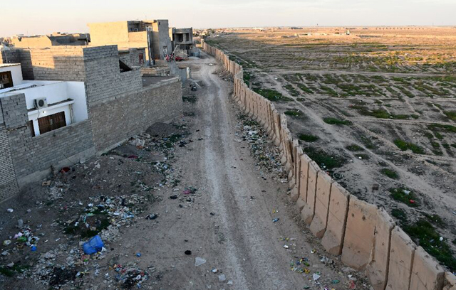 Years after civil war, security wall holds back Iraqi city | News
